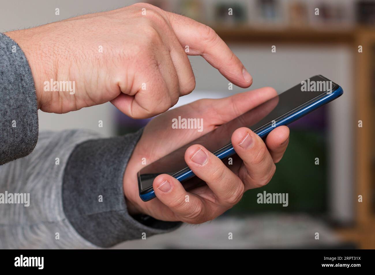 Close-up of a caucasian unrecognizable person's hand holding and going ...