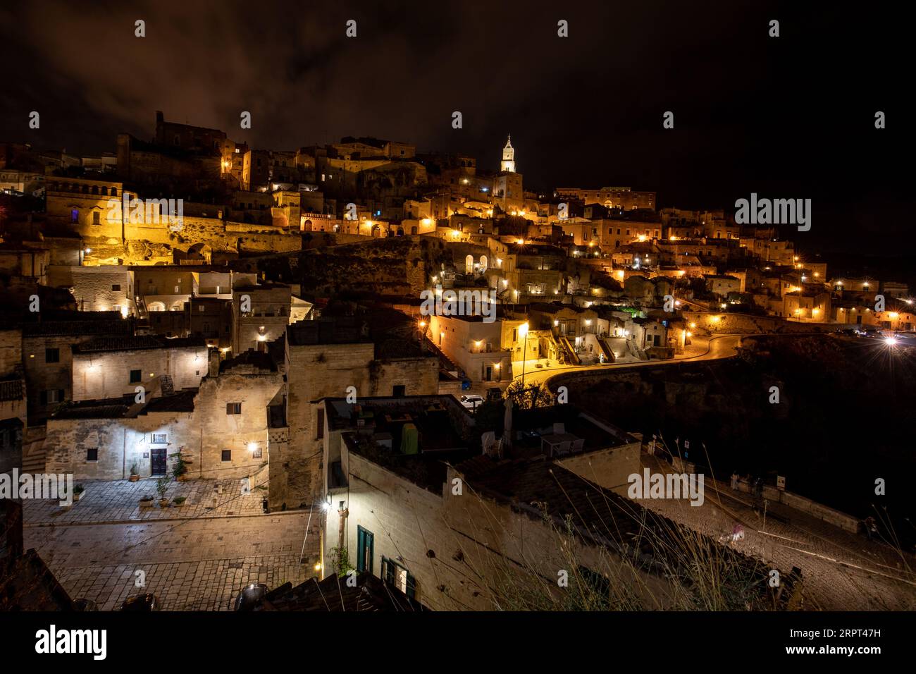 Amazing lighted buildings in ancient Sassi district by night in Matera ...