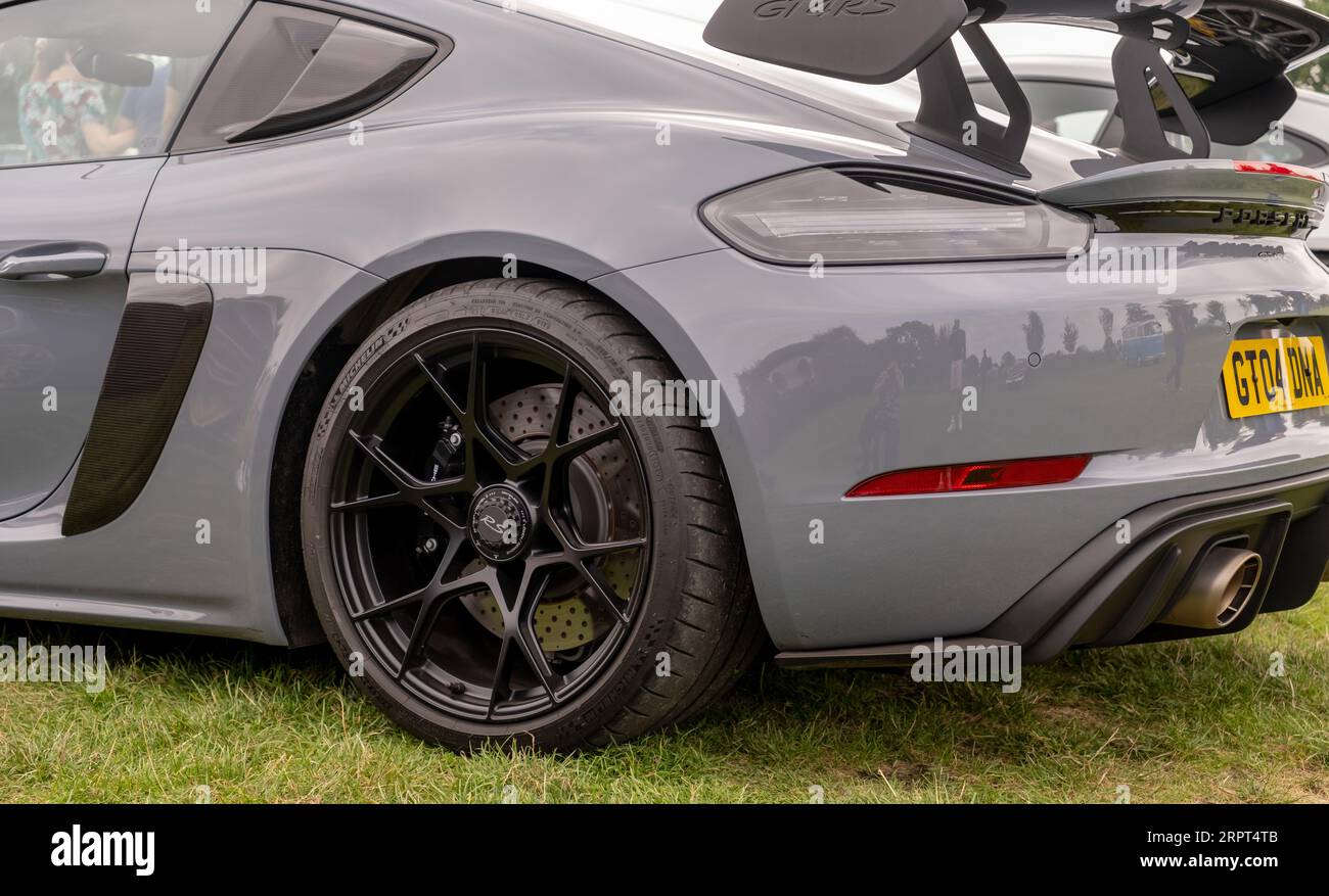 Close up of the rear end of a Porsche GT4 sports car on display at an ...