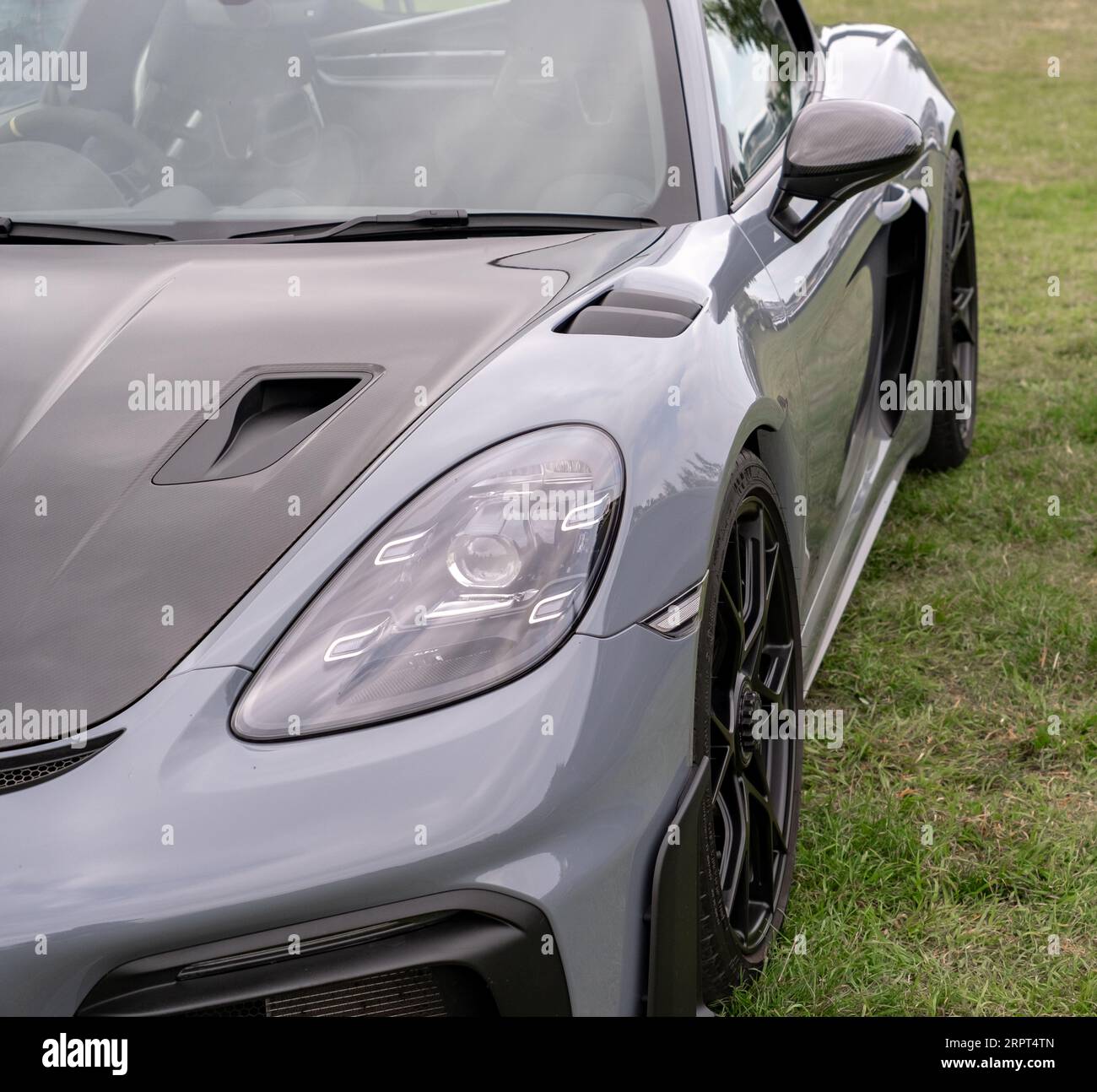 Front on view of a Porsche 911 GT4 sports car on display at an outdoor ...