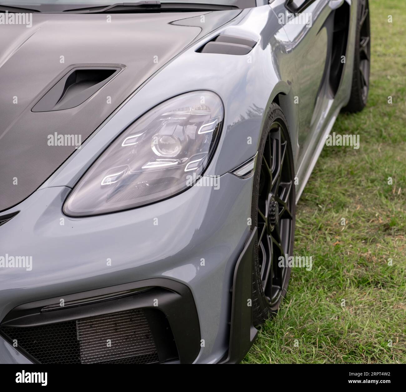 Front on view of a Porsche 911 GT4 sports car on display at an outdoor ...