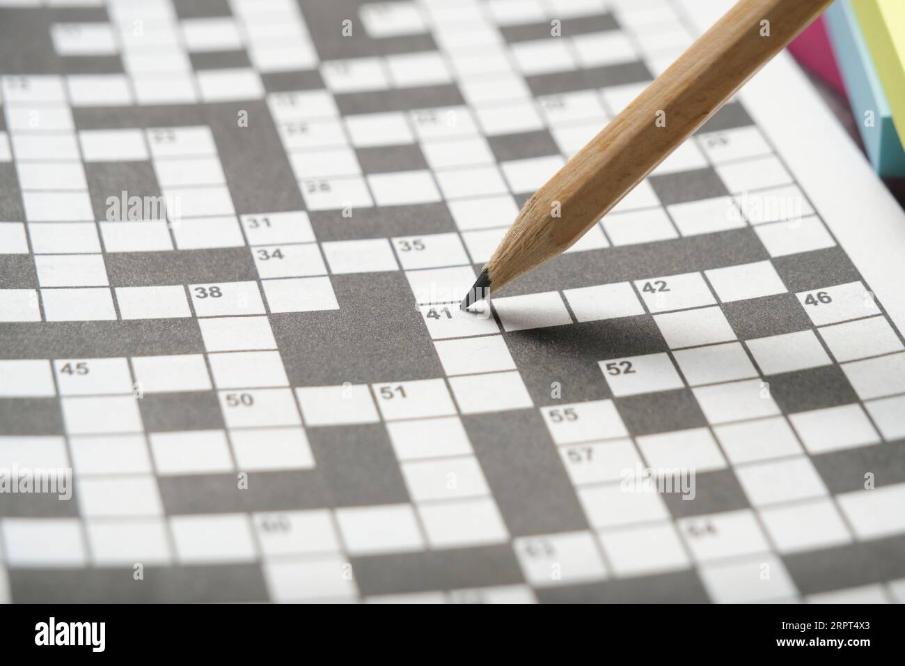 Simple pencil on background crossword puzzle sheet Stock Photo - Alamy