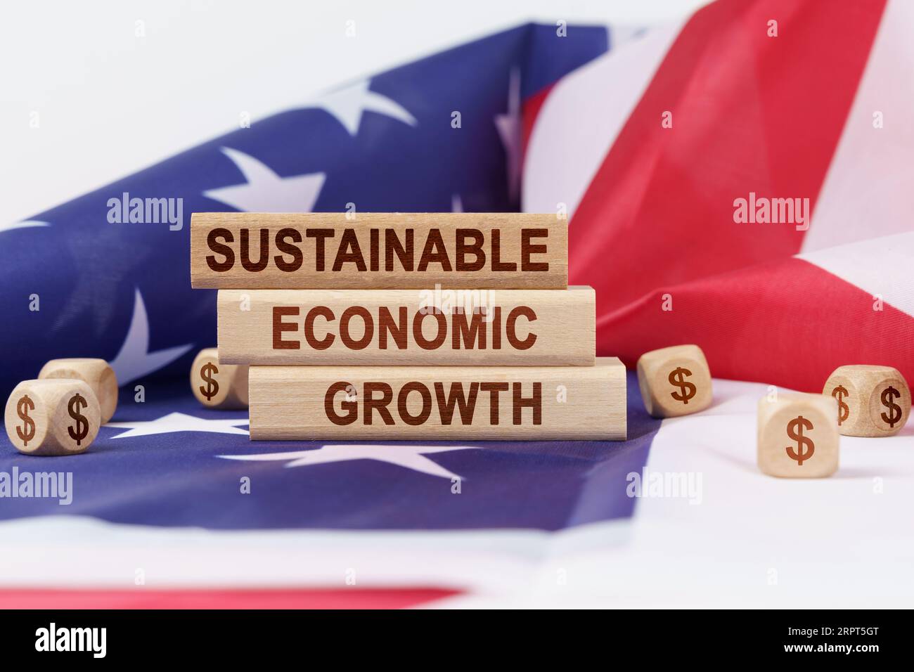Economy and finance concept. On the flag of the United States lie cubes ...