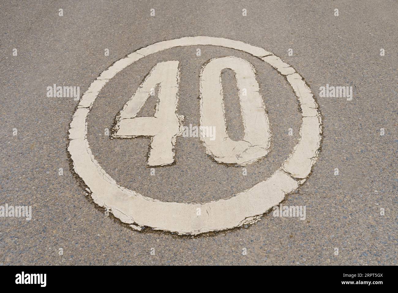 The speed limit sign is painted on the road with white paint. Close-up ...