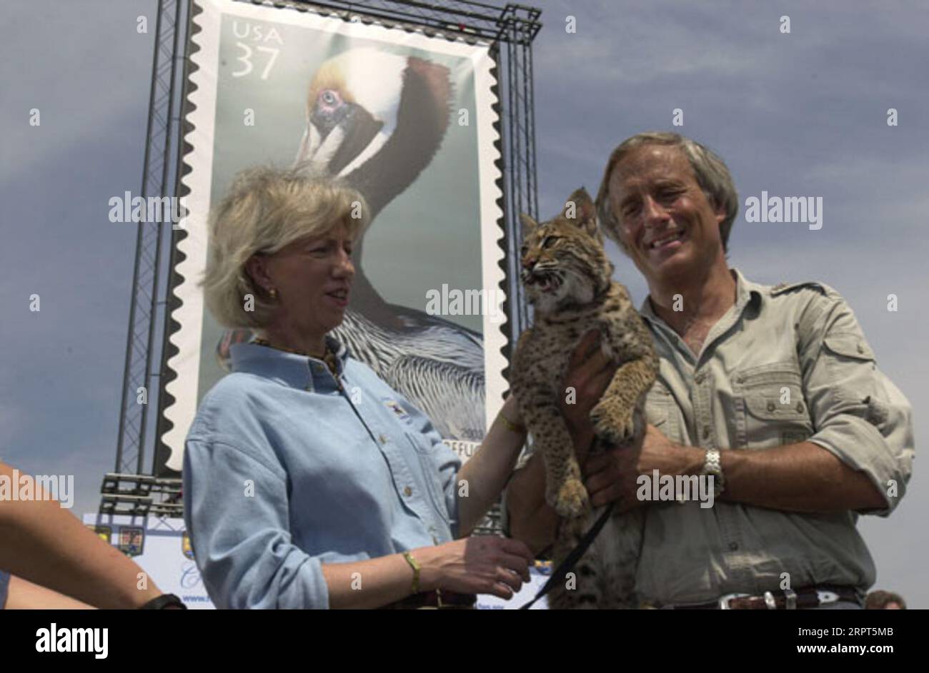 Secretary Gale Norton, left, admiring bobcat held by animal expert and ...