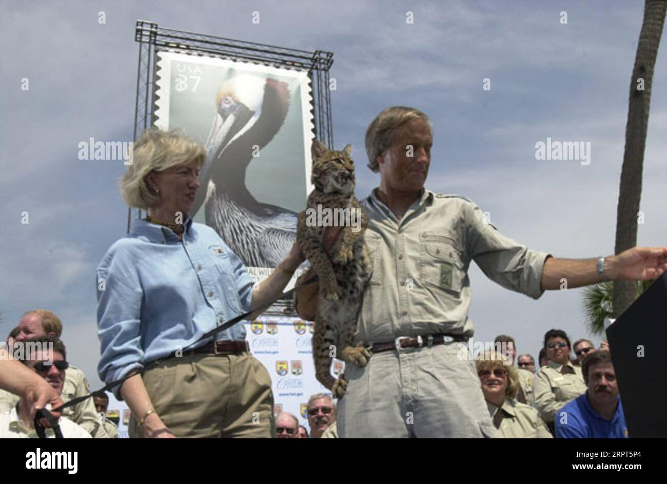 Secretary Gale Norton, left, admiring bobcat held by animal expert and ...