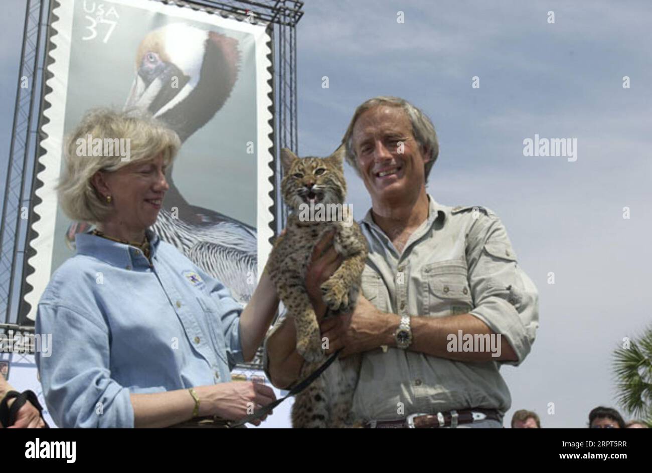 Secretary Gale Norton, left, admiring bobcat held by animal expert and ...