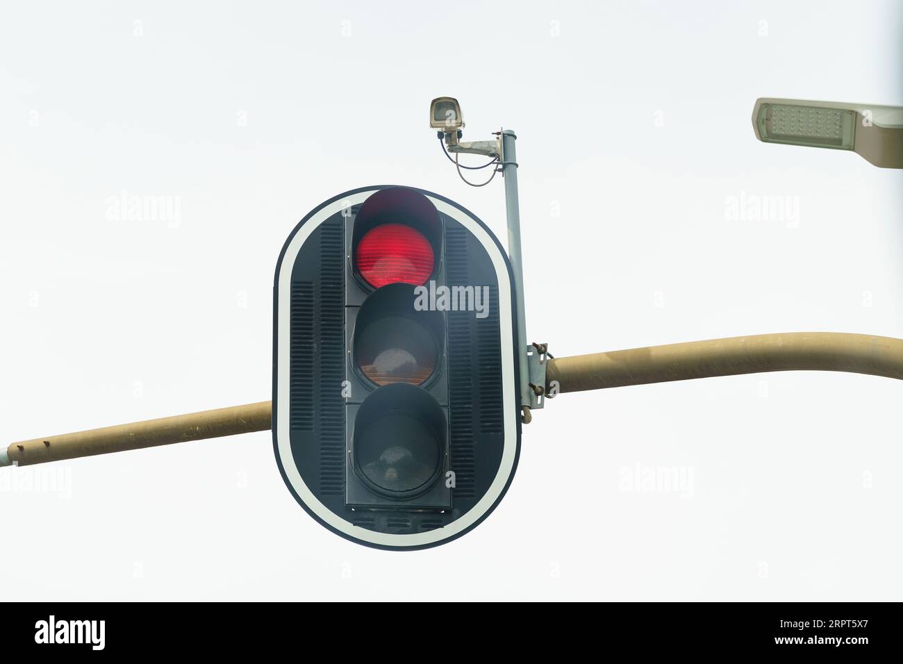 View of a traffic light and a traffic camera that captures the passage ...