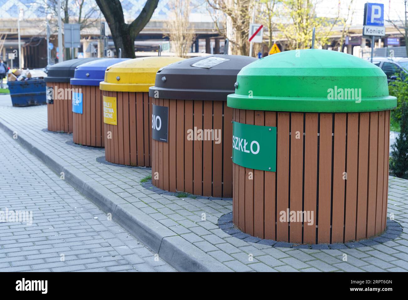 Sorting garbage into different containers. Caring for the environment ...