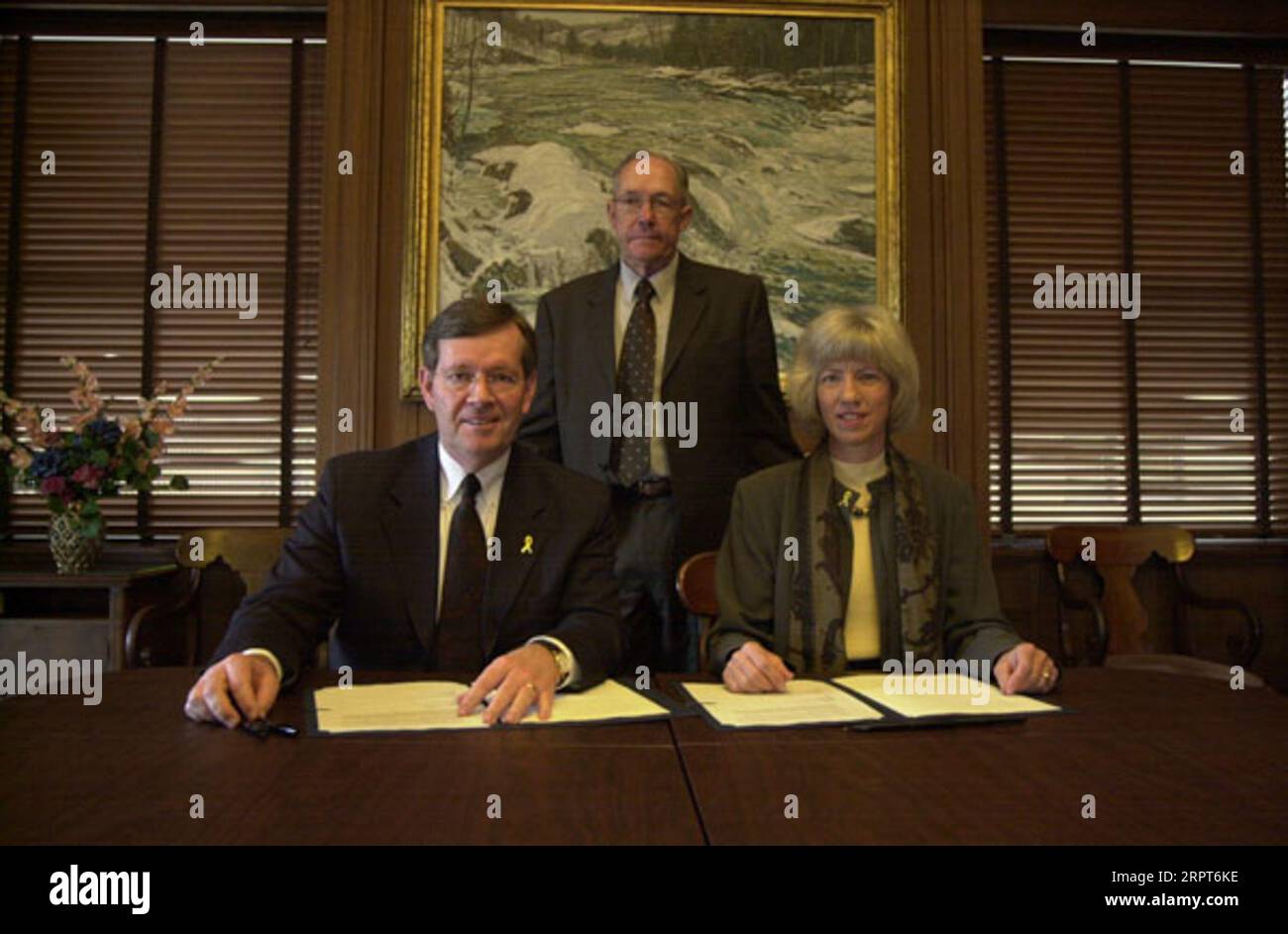 Utah Governor Mike Leavitt, seated left, and Secretary Gale Norton ...