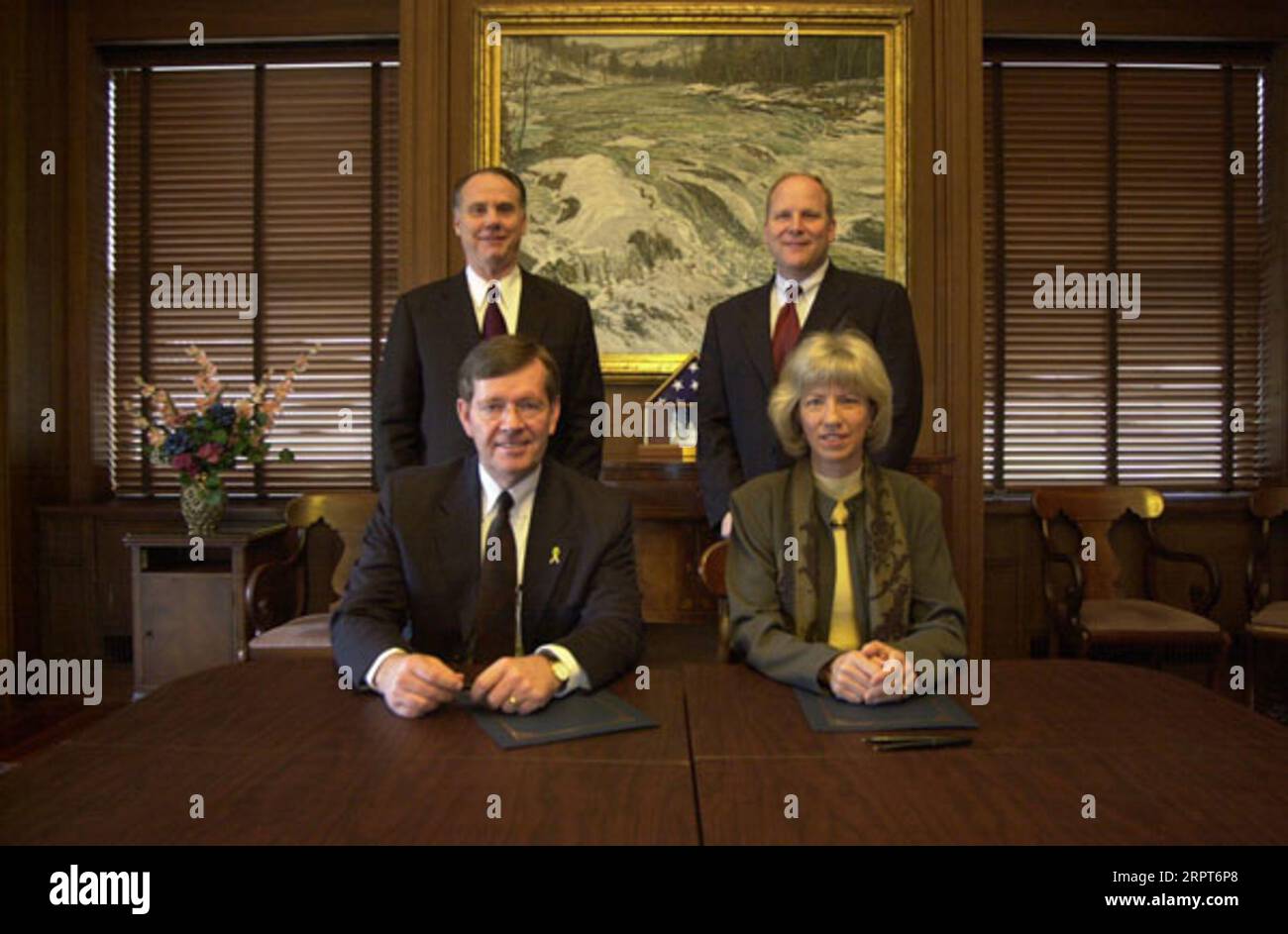 Utah Governor Mike Leavitt, seated left, and Secretary Gale Norton ...