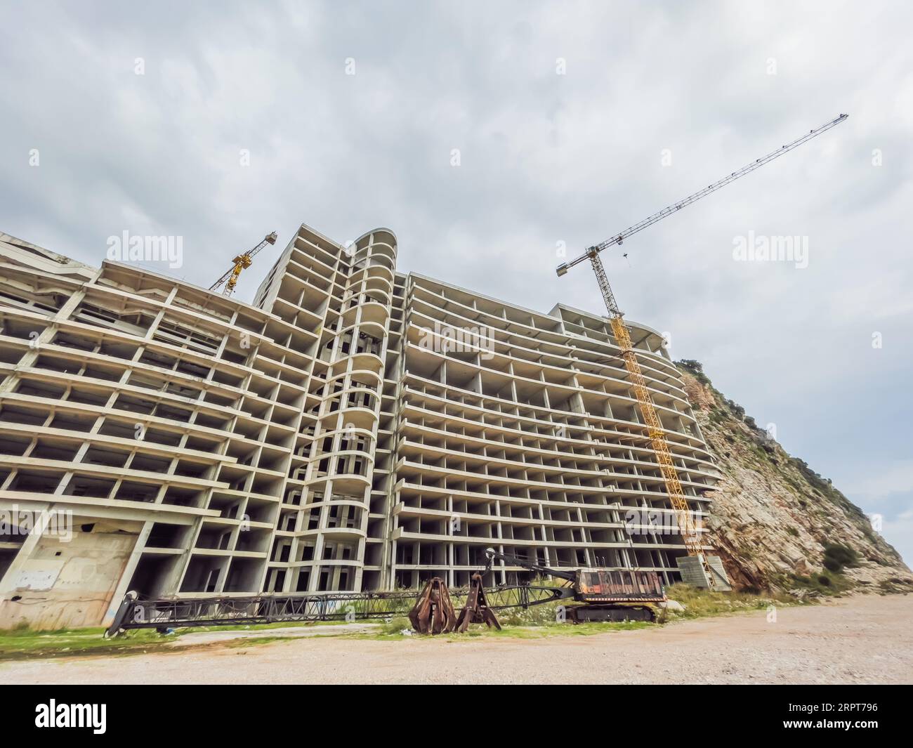 Massive concrete house taking shape, a work in progress. Construction site showcases modern ...