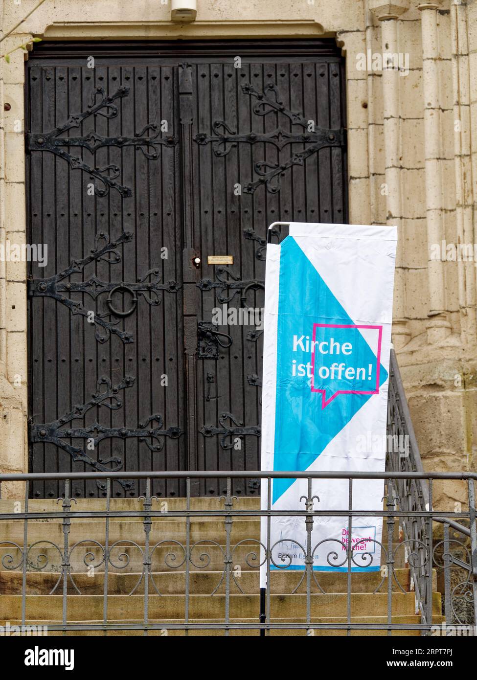 A poster on a church - Church is open, catholic church Stock Photo - Alamy