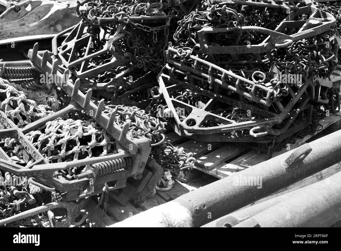 Commercial fishing tackle strewn on the harbourside in the busy working ...