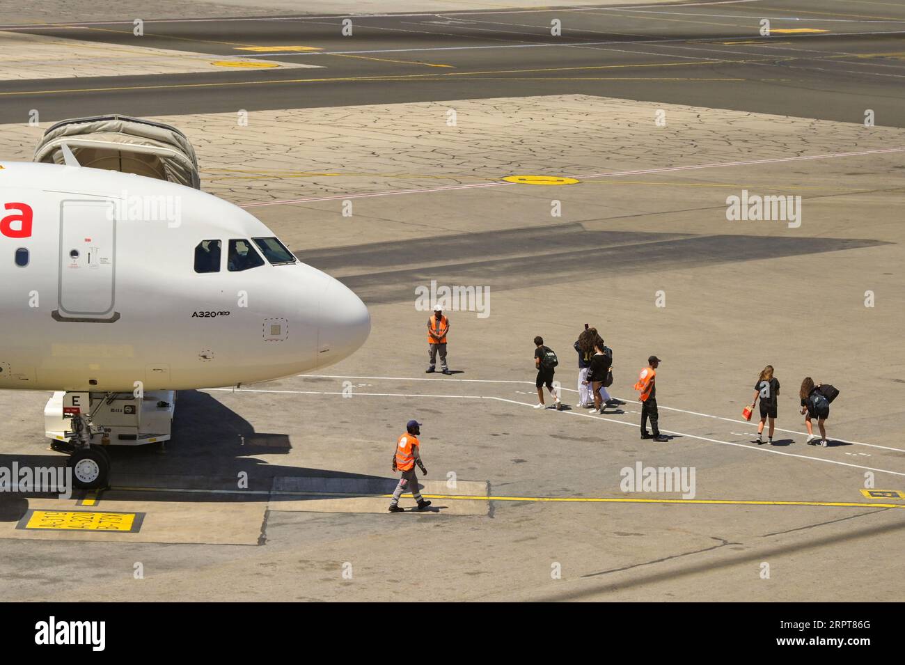 Luqa, Malta - 7 August 2023: Passengers walking out to board an Air ...