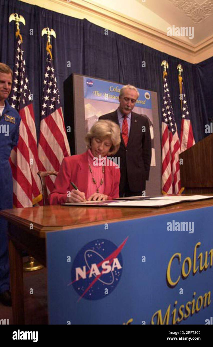 Secretary Gale Norton seated, with astronaut Scott Parazynski and ...