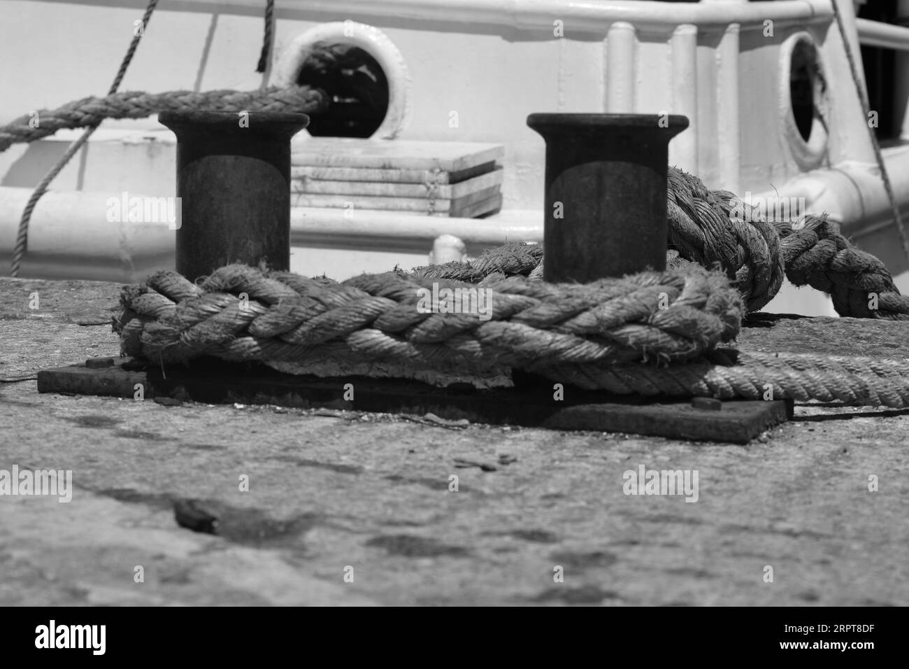 Large iron grappling hooks and thick ropes ropes on the boardwalks ...