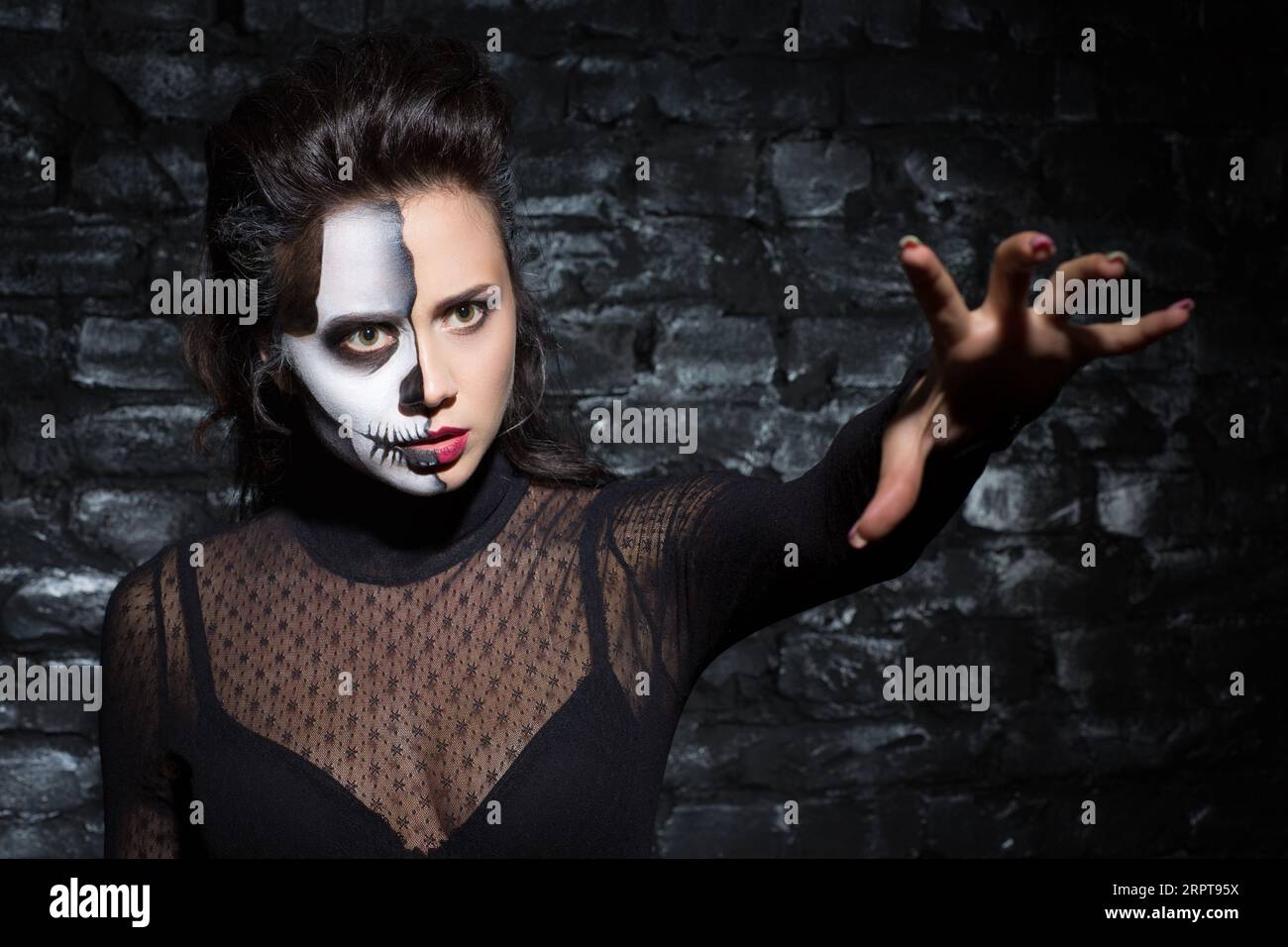 Serious woman scarring, by attacking and scratching during Halloween ...