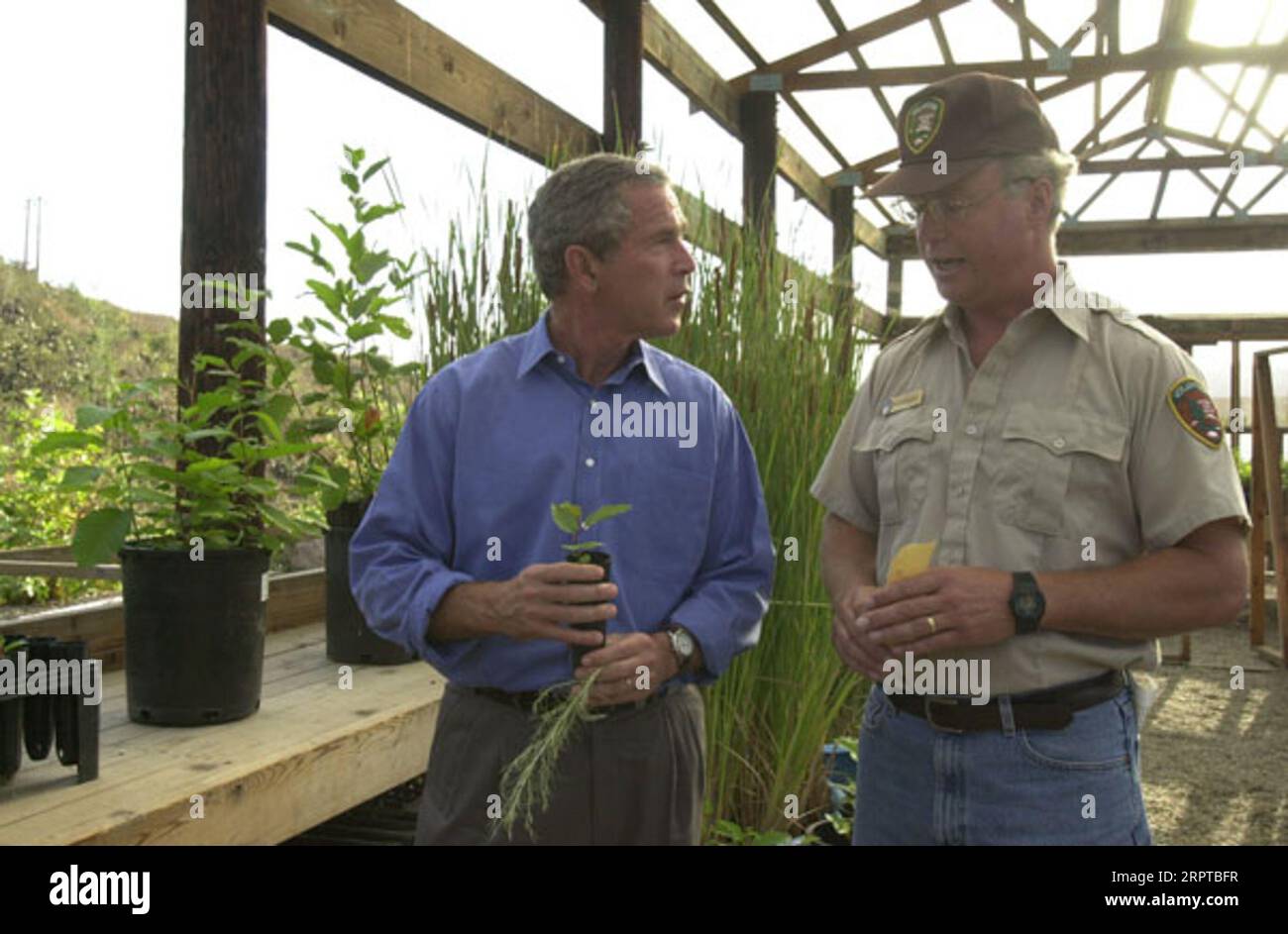 President George Bush, left, receiving briefing from Ralph Waycott ...