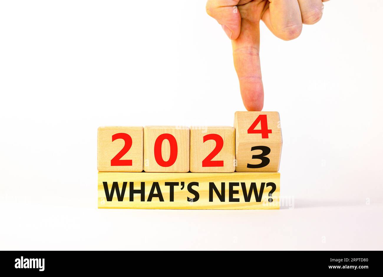 2024 what is new symbol. Businessman turns a wooden cube and changes ...