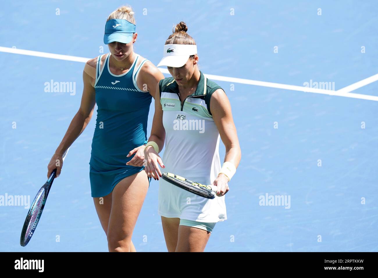 Magda Linette and Bernarda Pera during a women's doubles quarterfinal ...
