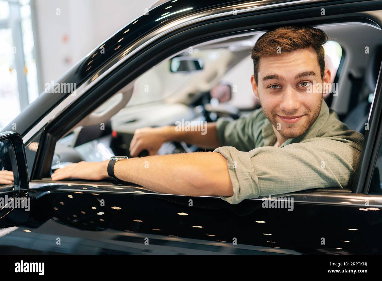 Portrait of happy handsome customer male client putting hand on ...