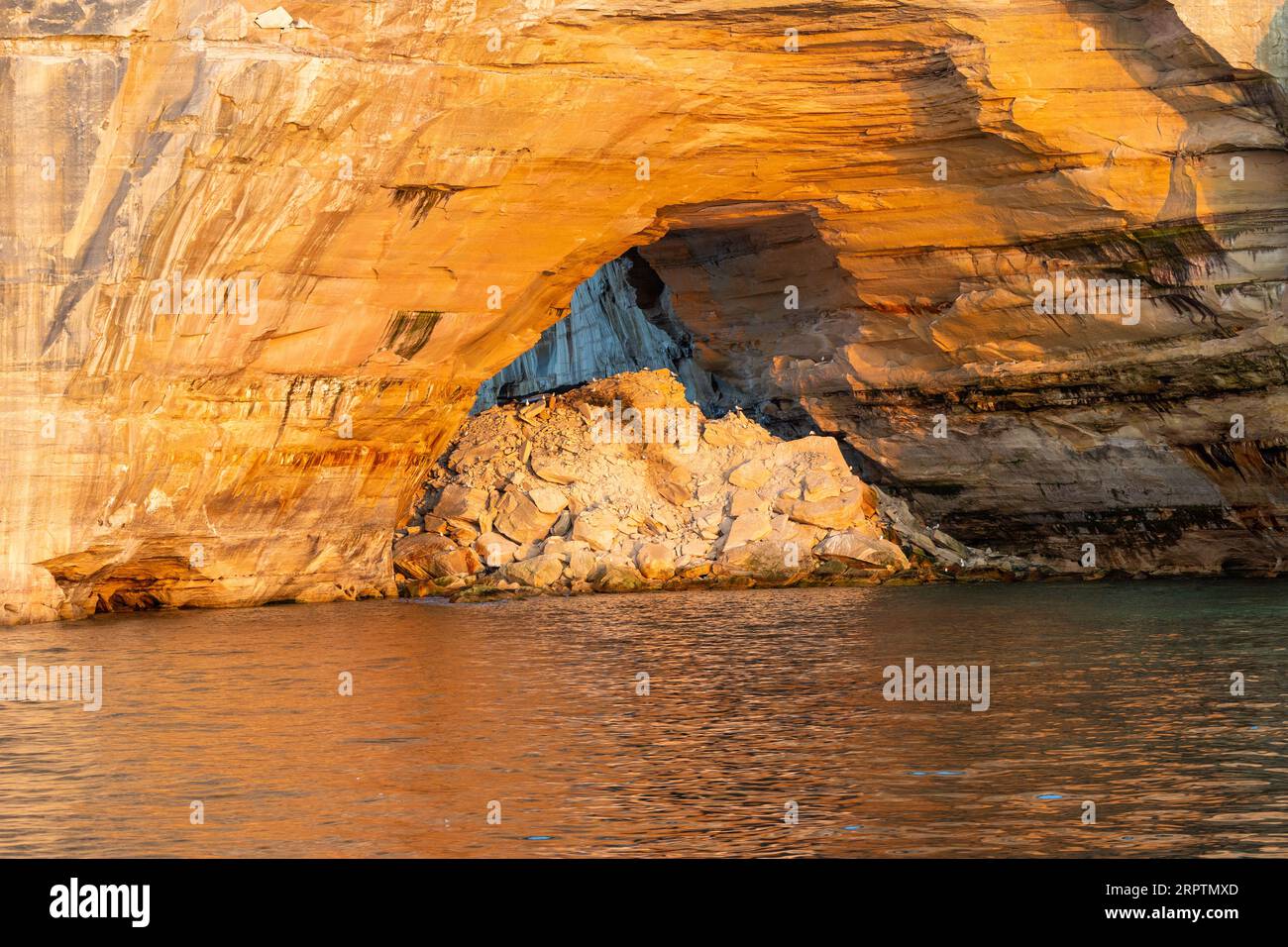 Birds on a portion of a collapsed natural arch along Pictured Rocks ...