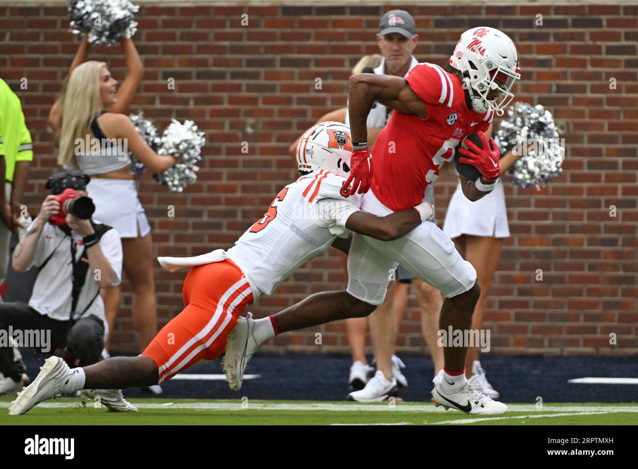 Mississippi wide receiver Tre Harris (9) fights for yards against ...