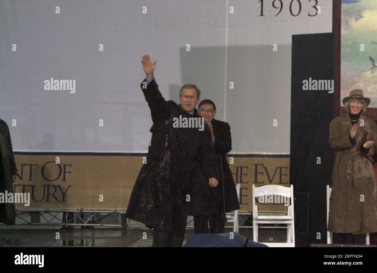 President George Bush waving, with Transportation Secretary Norman ...
