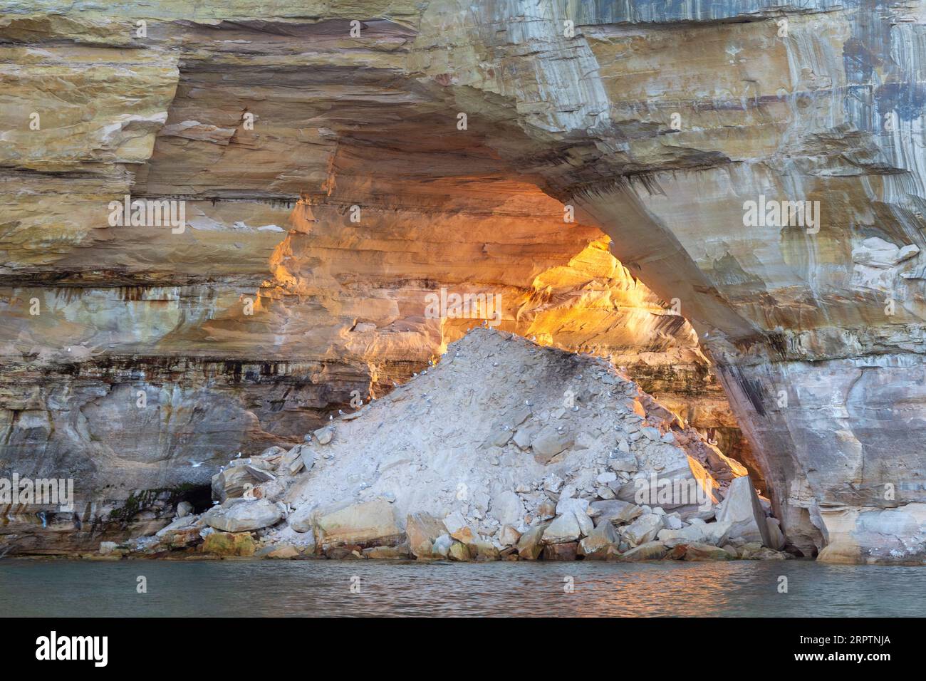 Birds on a portion of a collapsed natural arch along Pictured Rocks ...