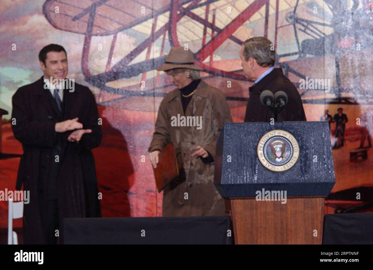 Actor John Travolta, Secretary Gale Norton, and President George Bush ...