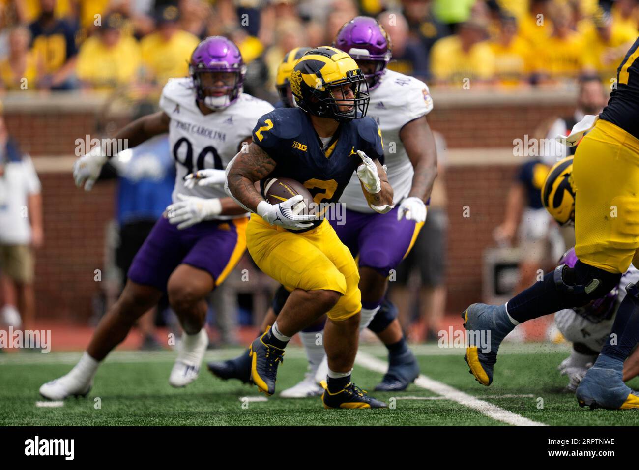 Michigan running back Blake Corum (2) runs the ball against East ...