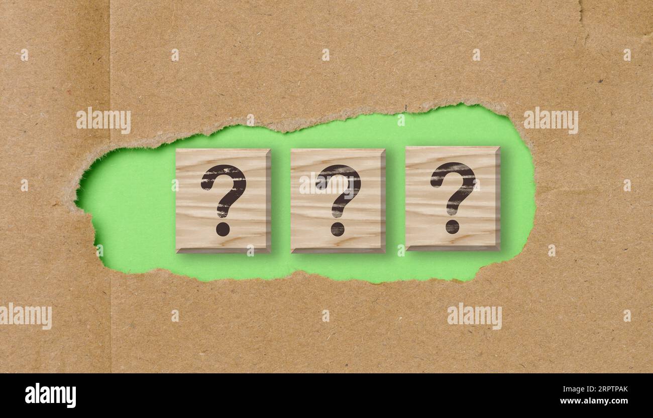 Wooden cubes with question marks, the concept of searching for truth ...