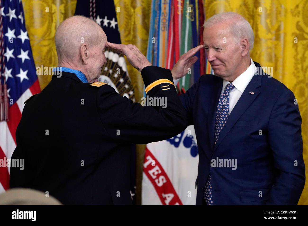President Joe Biden salutes after awarding the Medal of Honor to Capt ...