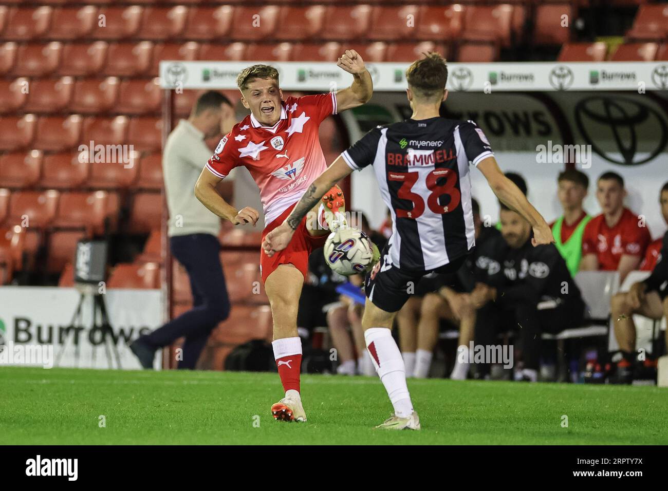 Aiden Marsh #19 of Barnsley and Jamie Bramwell #38 of Grimsby Town ...