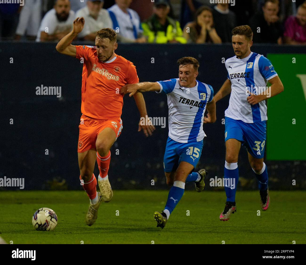 Matthew Pennington #5 of Blackpool breaks past Robbie Gotts #15 of ...