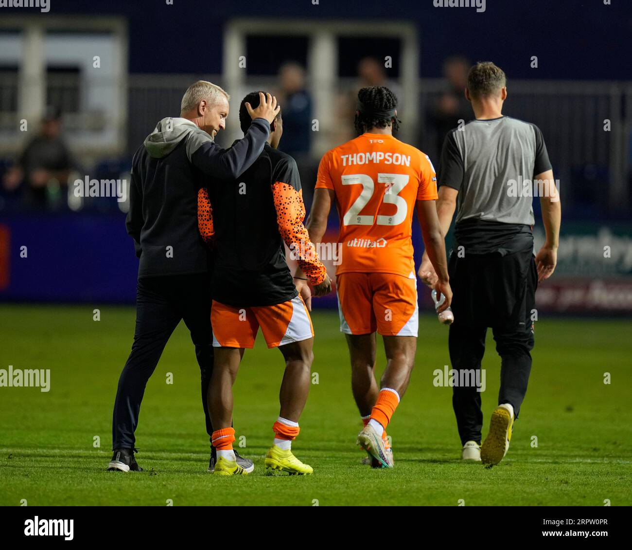 Neil Critchley, Manager of Blackpool put his arm around Karamoko ...