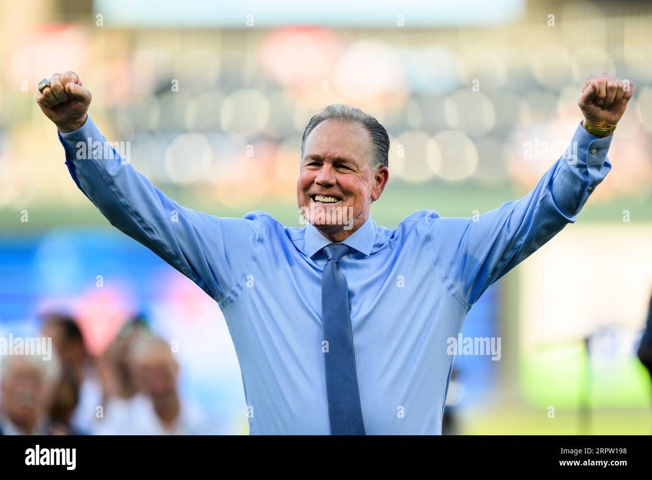 Former Kansas City Royals manager Ned Yost acknowledges the cheers of ...