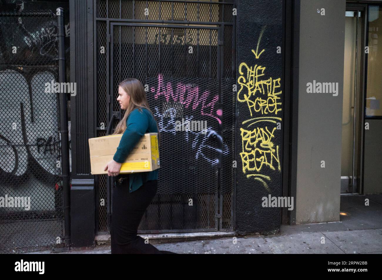 Seattle, USA. 8 Aug, 2023. A person passing graffiti in downtown Stock ...