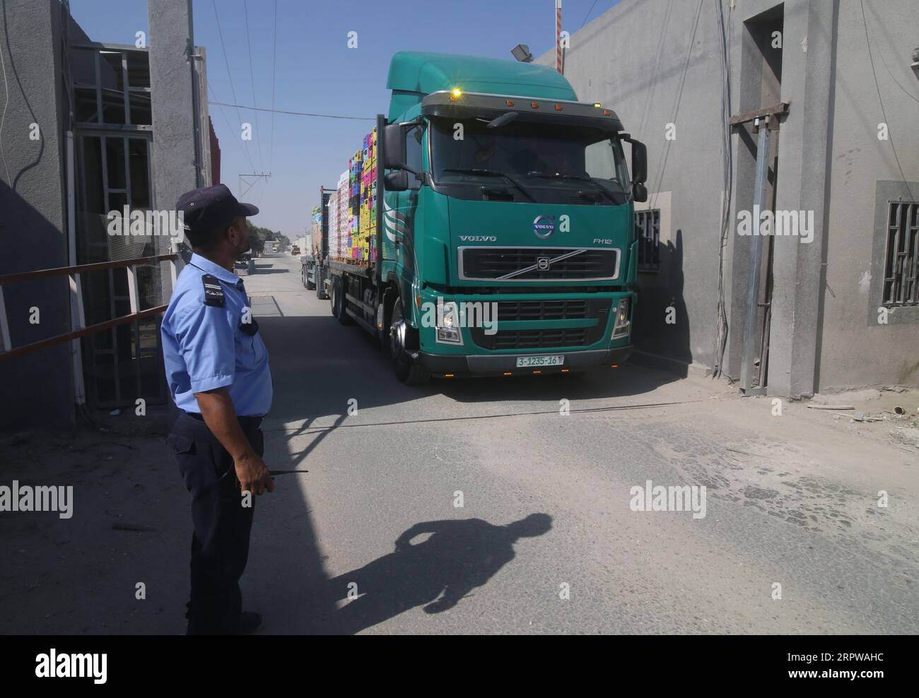 Gaza. 5th Sep, 2023. A Palestinian police officer stands near a truck ...