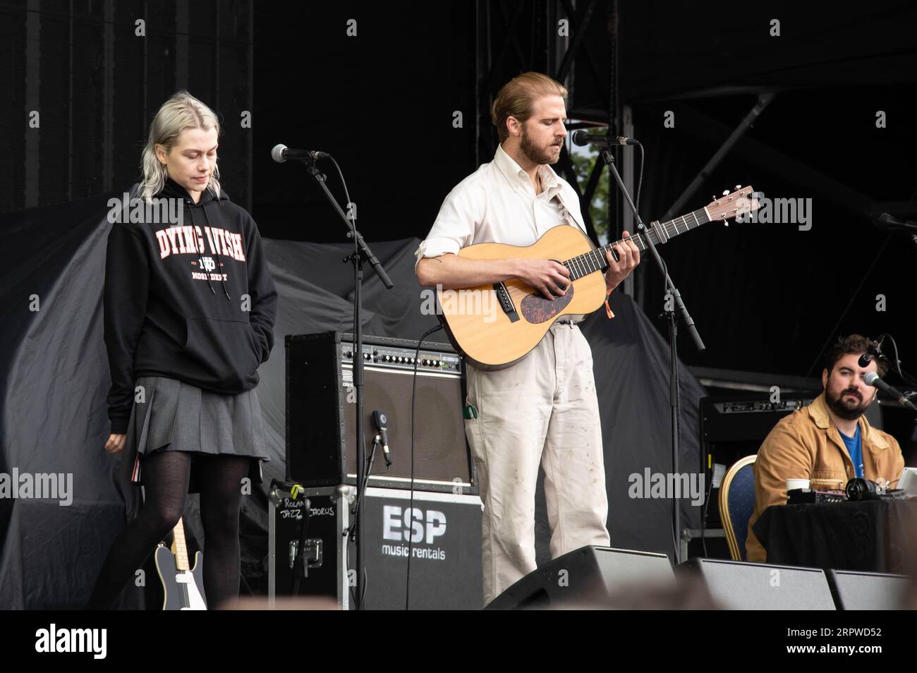 Photographs of Christian Lee Hutson and Phoebe Bridgers performing at ...