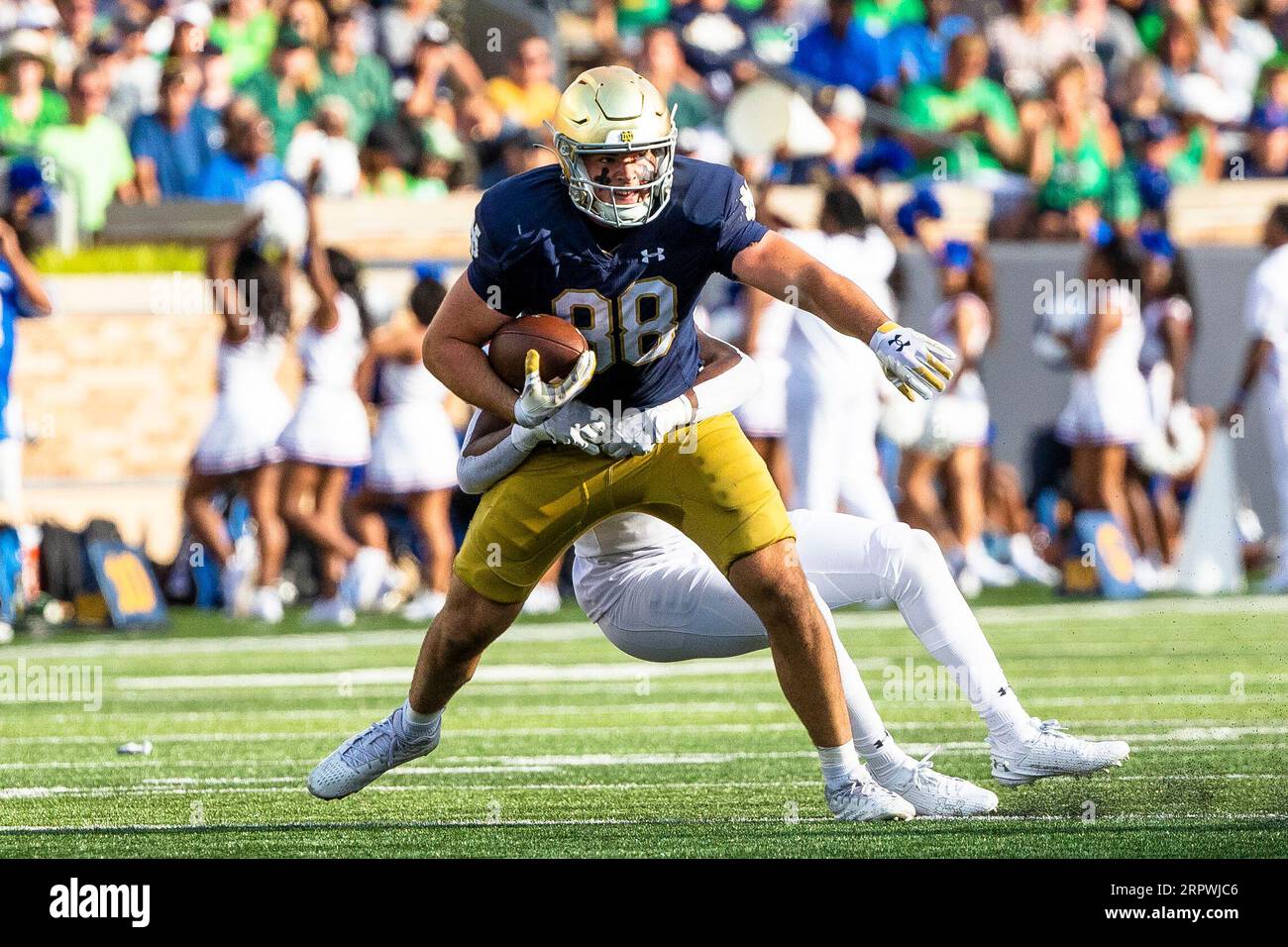 Notre Dame's Mitchell Evans (88) tries to get past Tennessee State's ...