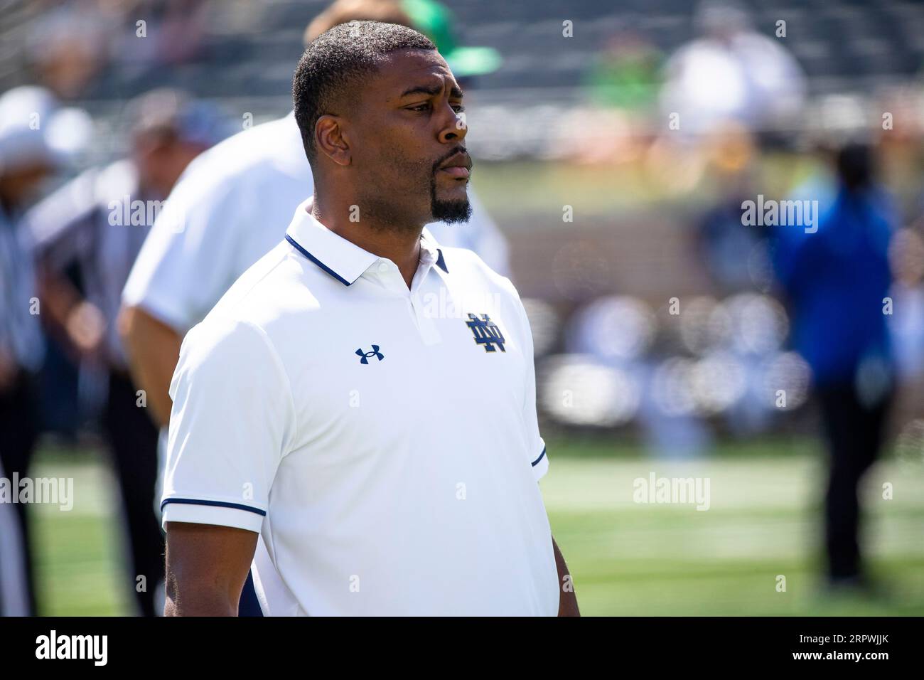 Notre Dame cornerbacks coach Mike Mickens walks the field before the ...