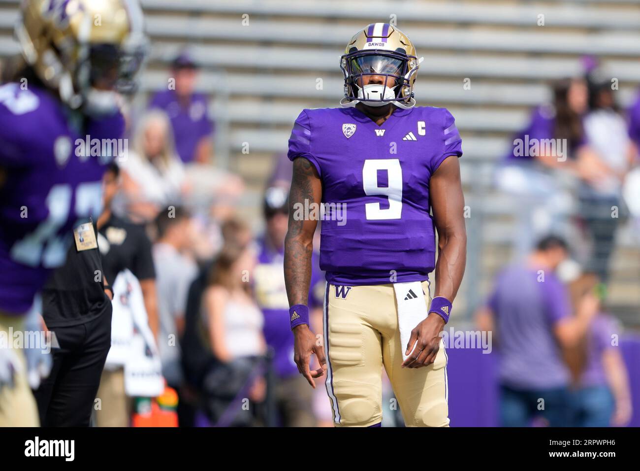 Washington quarterback Michael Penix Jr. warms up before an NCAA college football game against ...