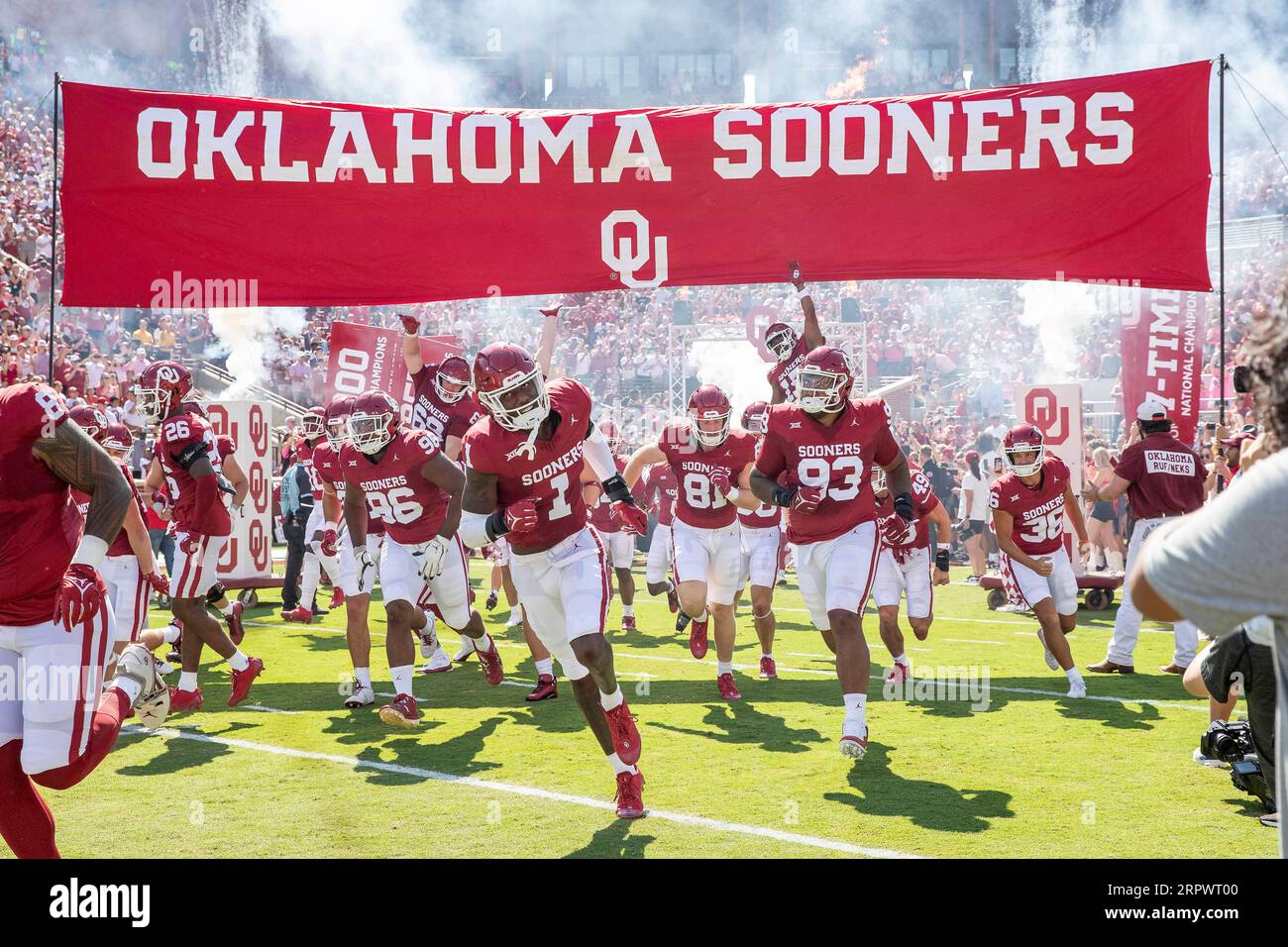 Oklahoma runs onto the field before an NCAA college football game ...
