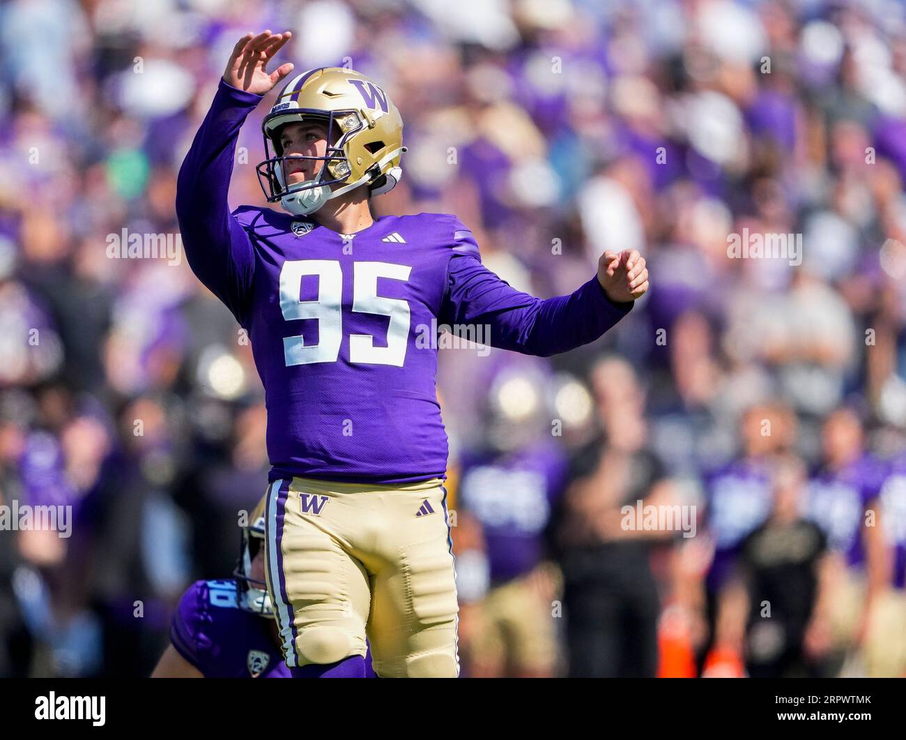 Washington place kicker Grady Gross looks on after making an extra ...