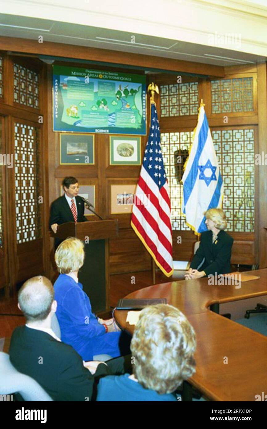 Israel's Ambassador to the U.S., Daniel Ayalon, speaking at podium ...