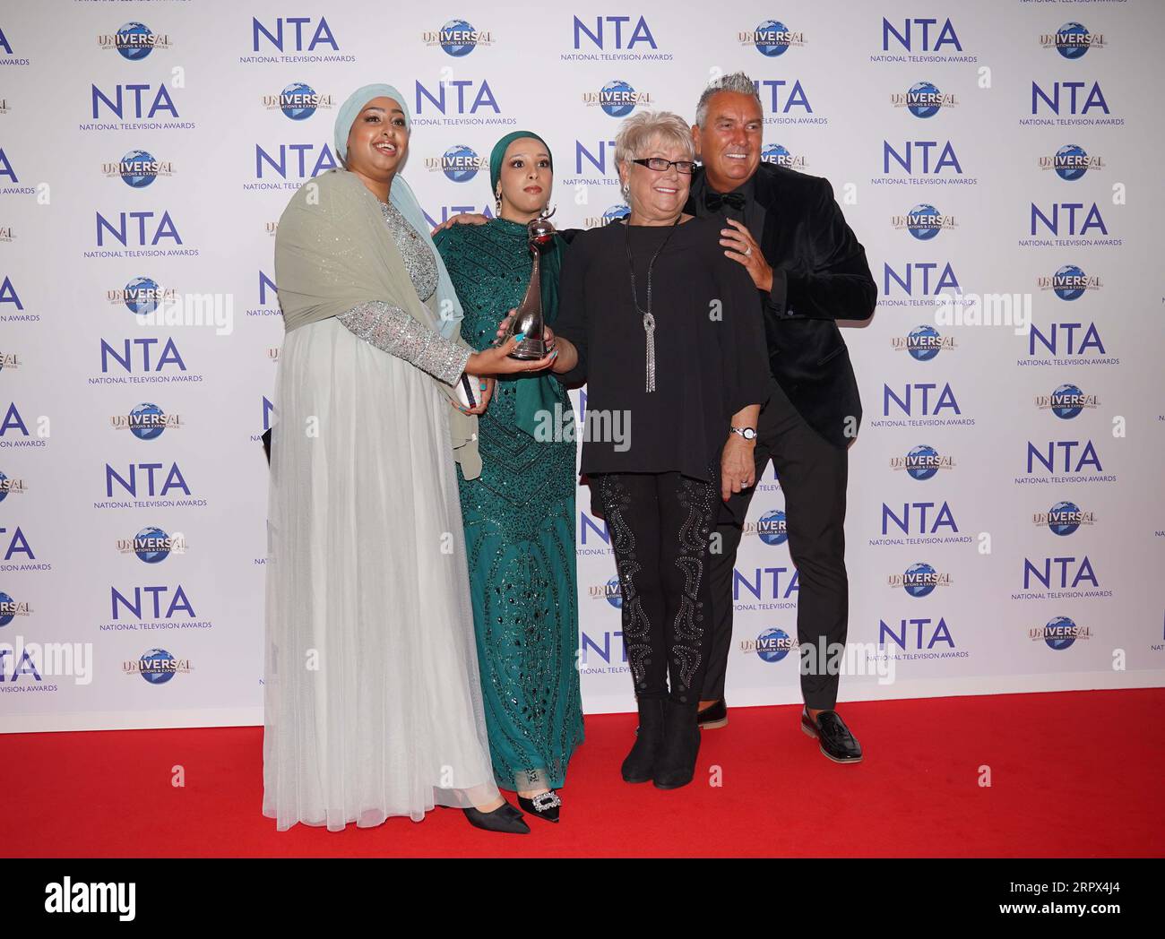 (L to R) Amira Rota, Amani Rota, Jenny Newby and Lee Riley, accepting ...