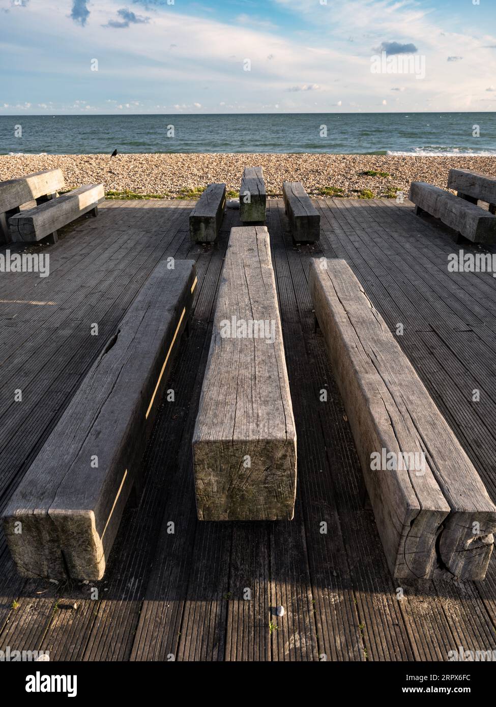 Slabs of timber serving as seating outside the East Beach Cafe in ...