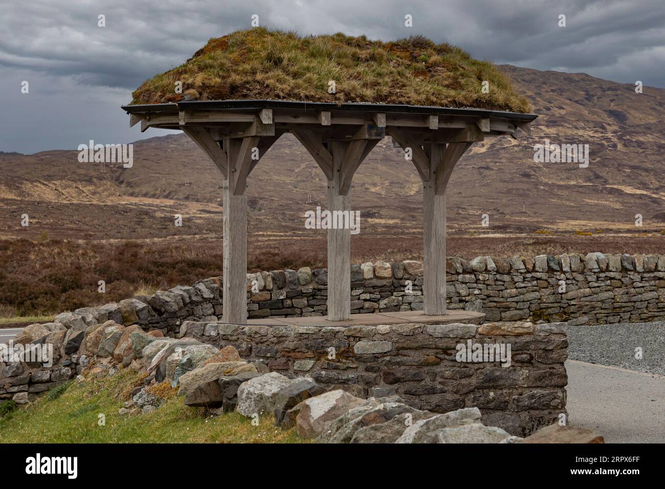 Wooden eco friendly seating out in the countryside with a grass covered ...